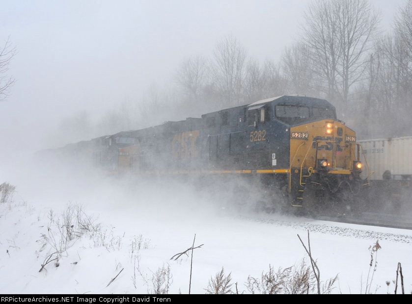 CSX 5282 leads Eastbound CSX Q122 at MP QD105 on track number two